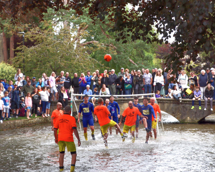 When does 'Football in the River' take place in Bourton on the Water
